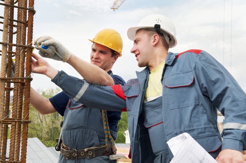 Construction Co-workers Discussing Stock Image - Image of blue, male ...