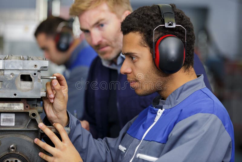 Engineer with apprentice stock photo. Image of cooperation - 232509294