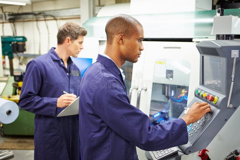 Engineer Teaching Apprentices To Use Computerized Lathe Stock Photo ...