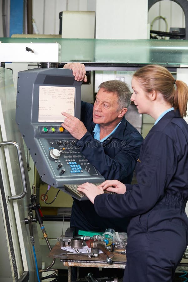 Engineer Showing Apprentice How To Use Computerized Cutting Mach Stock ...