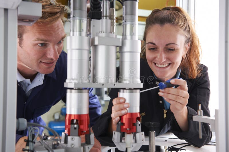 Engineer Teaching Apprentice To Use Computerized Lathe Stock Photo ...