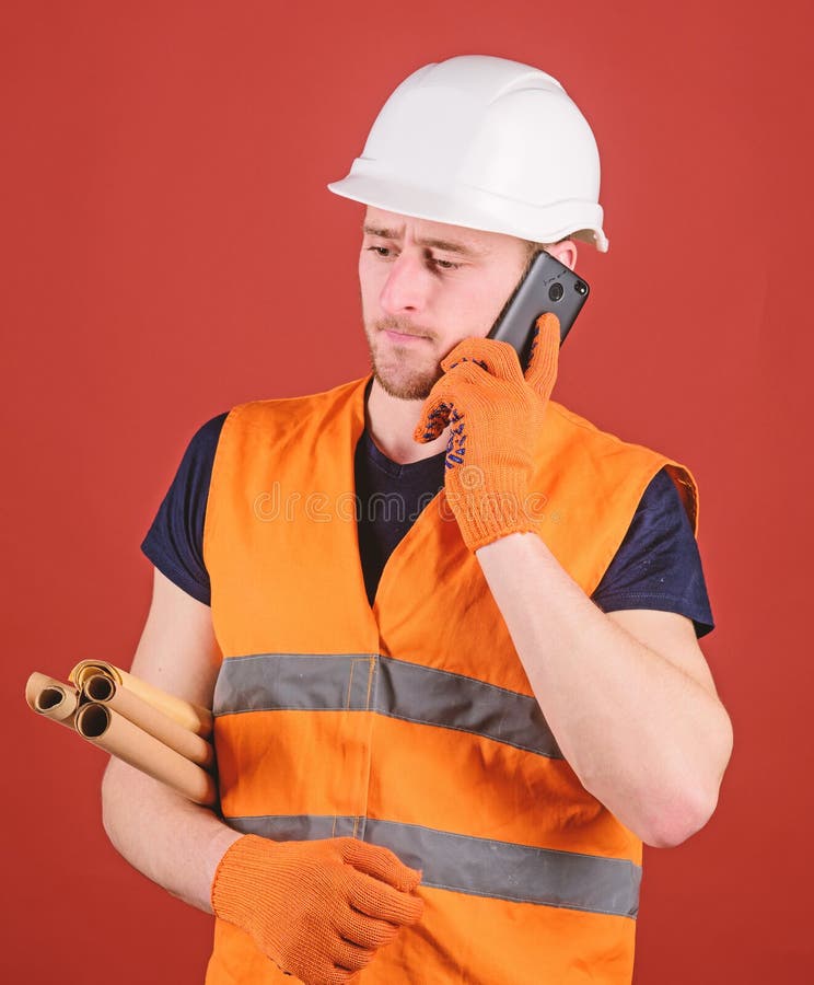 Engineer, Architect, Builder on Busy Face Speaks on Smartphone while ...