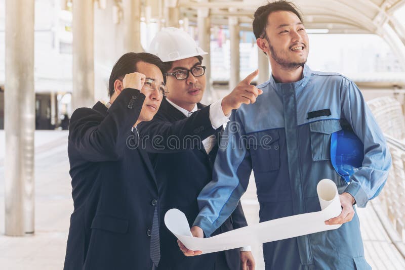 Engineer and Business Man Discuss about Blueprint Stock Photo - Image ...
