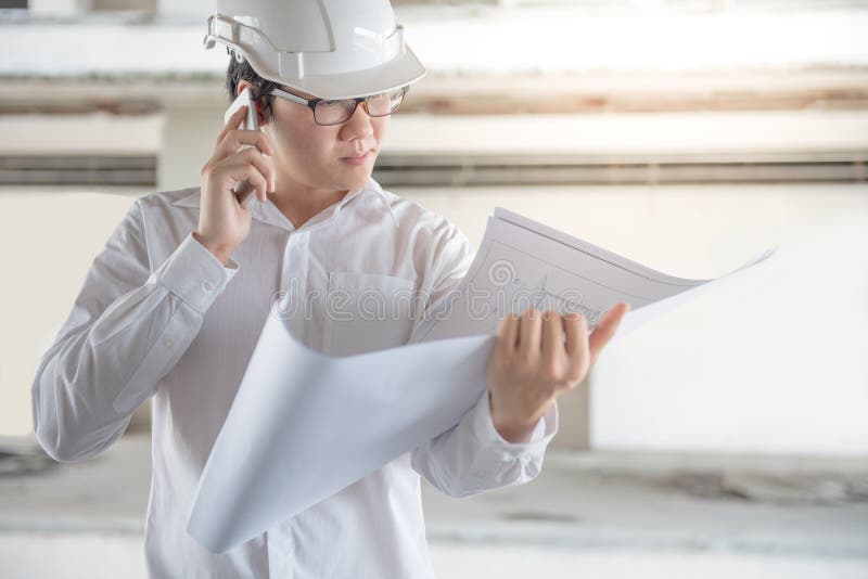 Engineer or Architect Checking Architectural Drawing Stock Photo ...