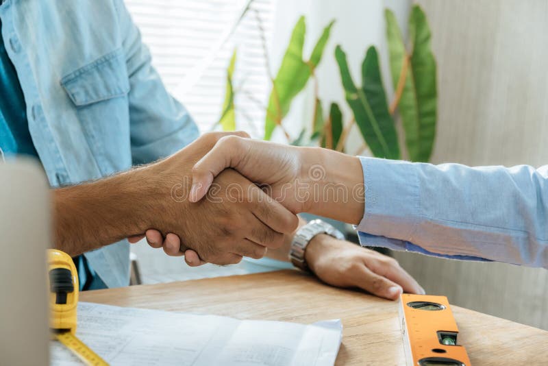 Engineer, Architect, Construction Worker Team Hands Shaking after Plan ...