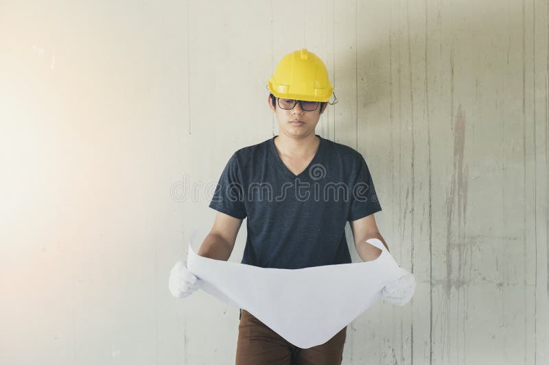 Engineer or Architect Holding Blueprint in Building Construction Site ...