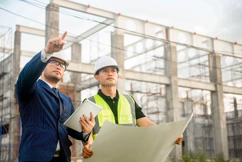 Engineer and Architect Monitor the Progress of Building Construction ...
