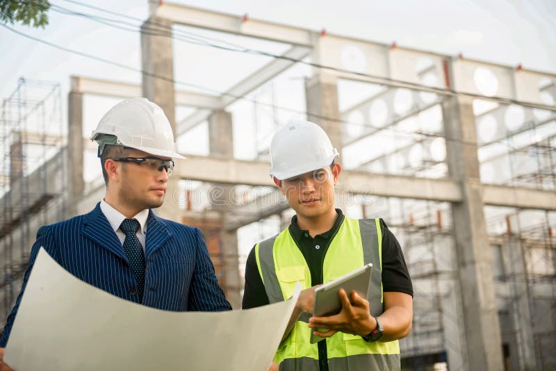 Engineer and Architect Monitor the Progress of Building Construction ...