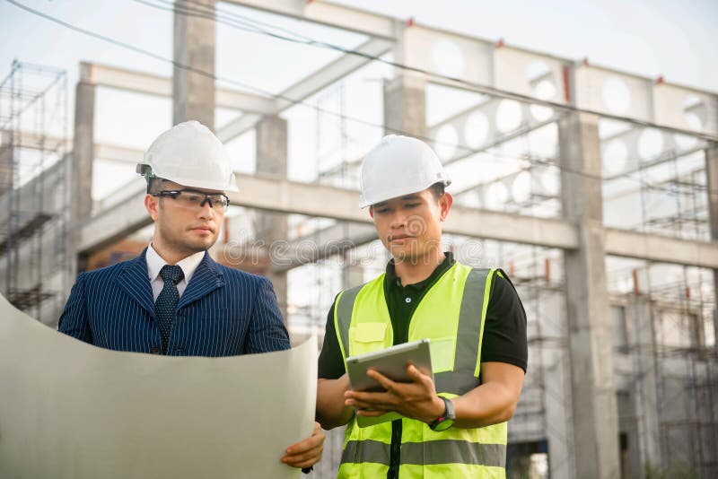Engineer and Architect Monitor the Progress of Building Construction ...