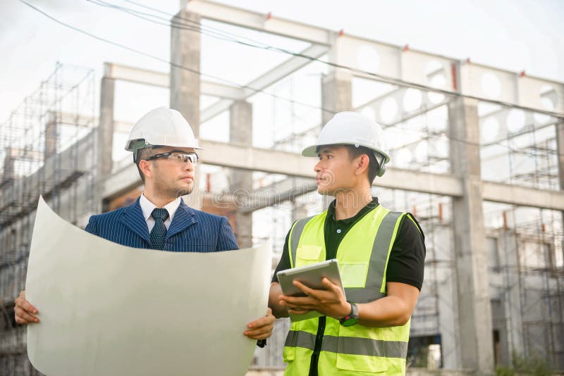 Engineer and Architect Monitor the Progress of Building Construction ...