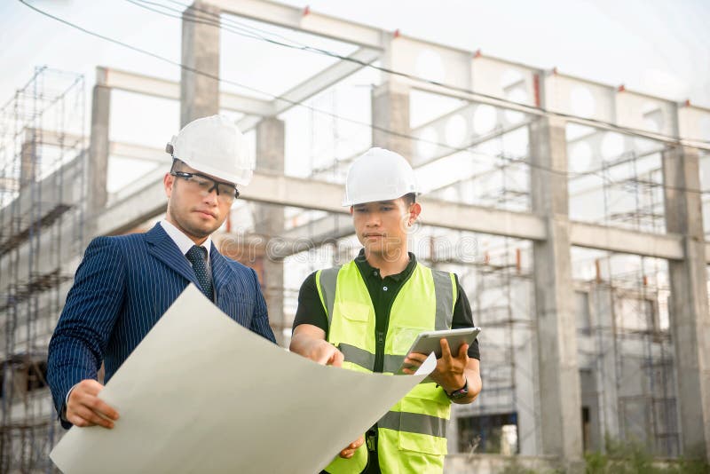 Engineer and Architect Monitor the Progress of Building Construction ...