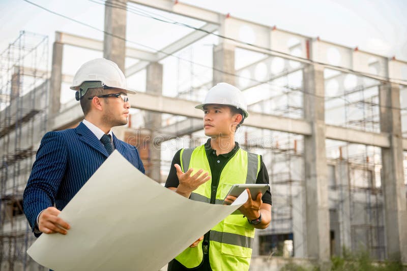 Engineer and Architect Monitor the Progress of Building Construction ...