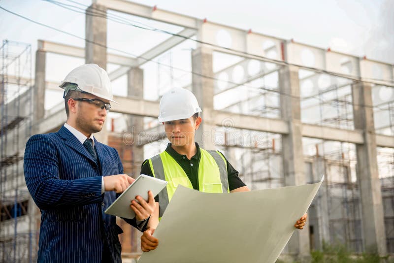 Engineer and Architect Monitor the Progress of Building Construction ...