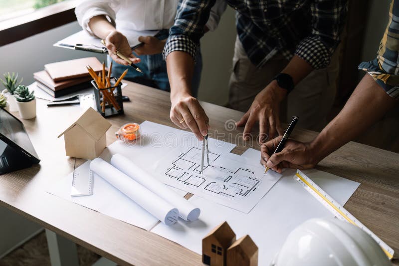 Engineer and Architect People Meeting Working and Hand Drawing on ...