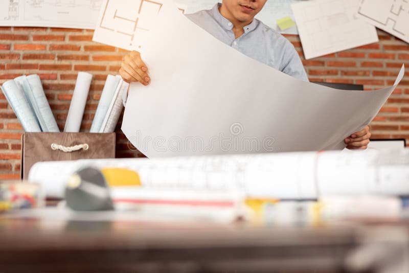 Engineer or Architect is Reading Paper Blueprint Project Plan. Civil ...