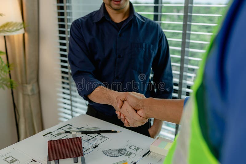 Engineer and Architect are Shaking Hands To Celebrate because they Just ...