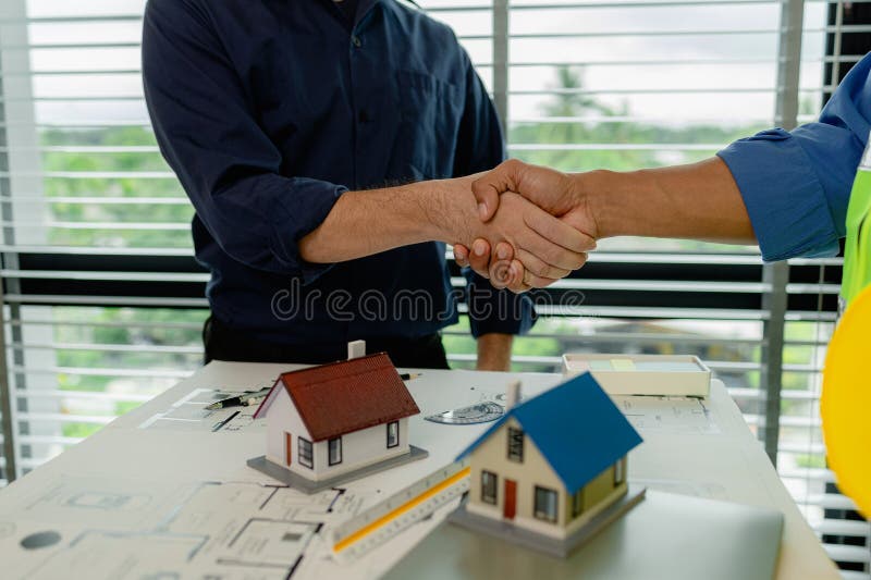 Engineer and Architect are Shaking Hands To Celebrate because they Just ...