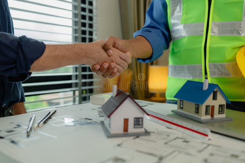 Engineer and Architect are Shaking Hands To Celebrate because they Just ...