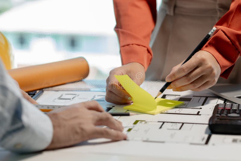 Engineer and Architect Work Together in the Office of a Construction ...