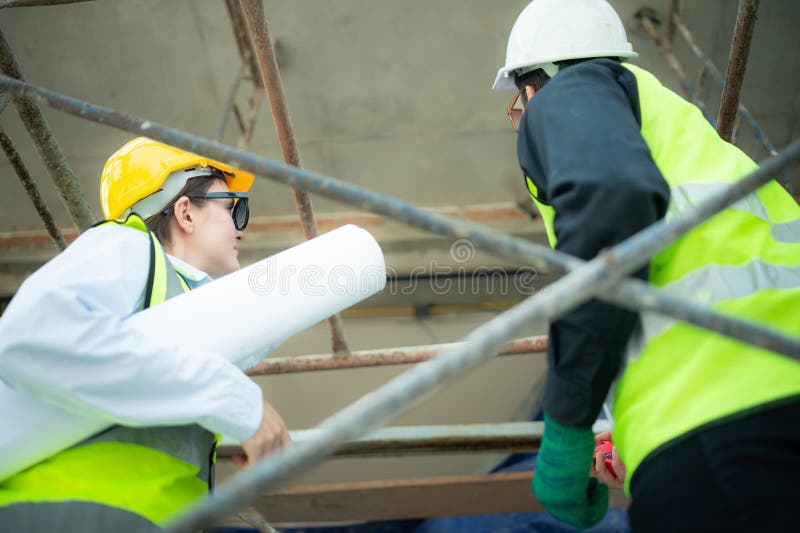 Engineer and Architect Working on the Construction Site, Double ...