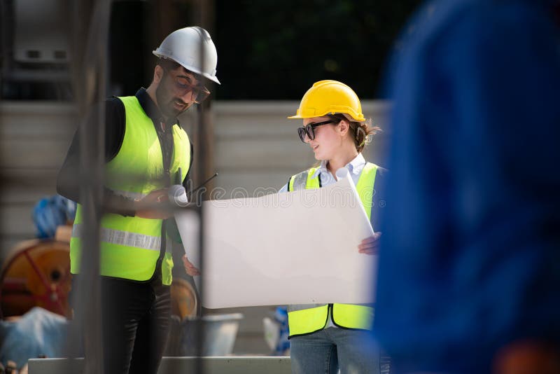 Engineer and Architect Working on the Construction Site, Double ...