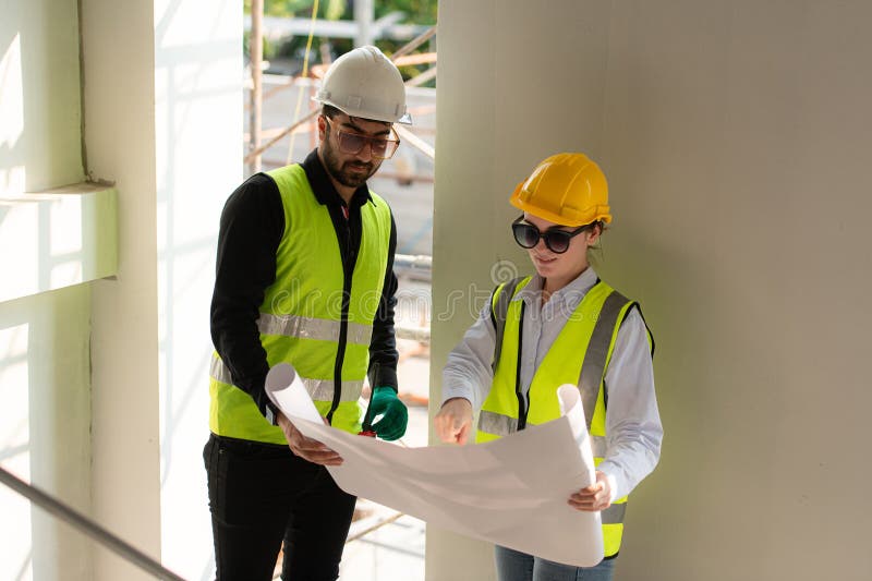 Engineer and Architect Working on the Construction Site, Double ...