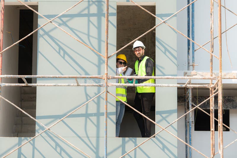 Engineer and Architect Working on the Construction Site, Double ...