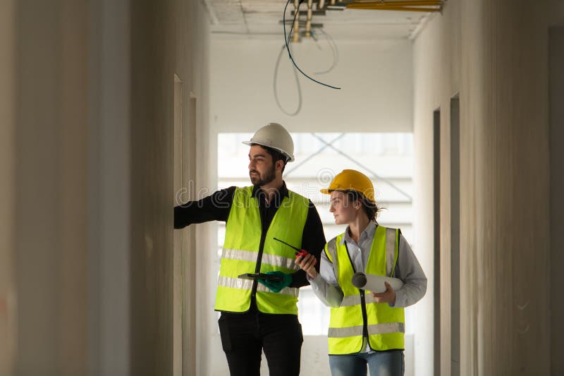 Engineer and Architect Working on the Construction Site, Double ...