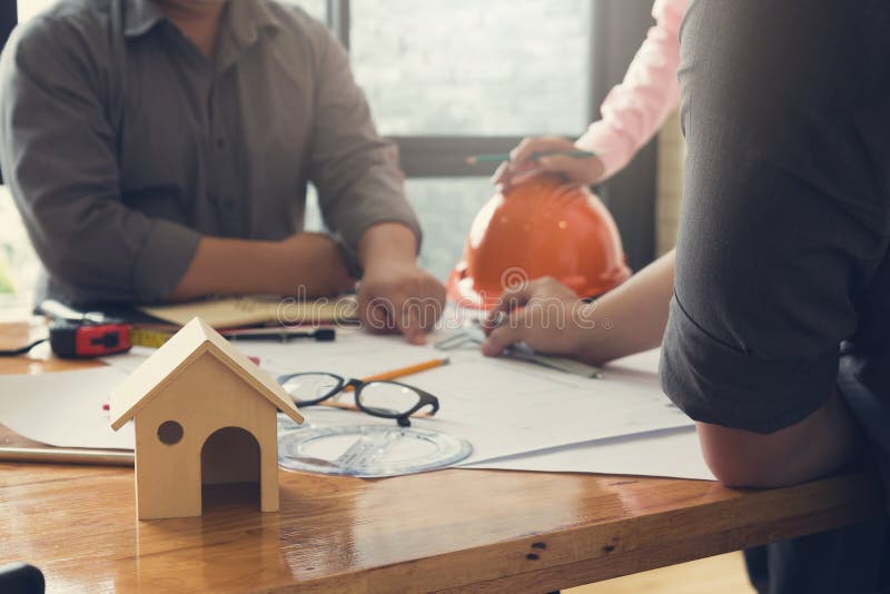 Engineer Architects Office Team Working and Discussing House Plan with ...
