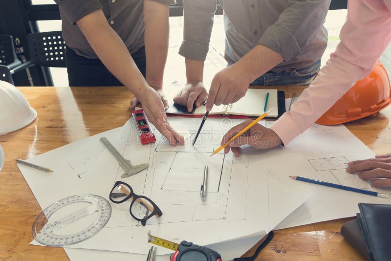 Engineer Architects Office Team Working and Discussing House Plan with ...