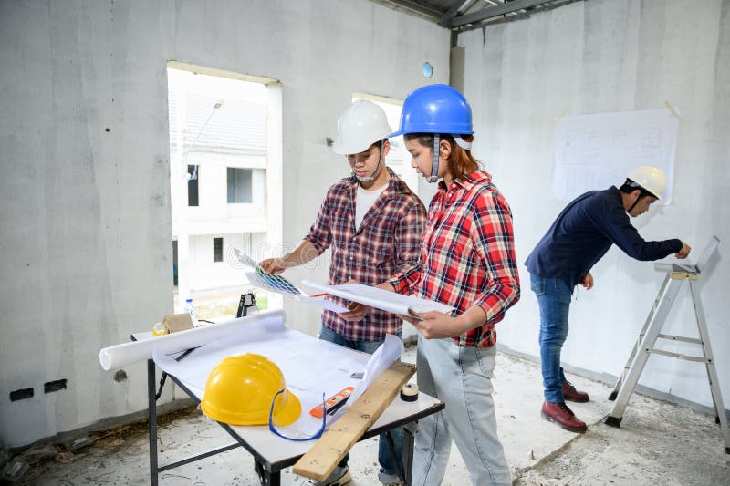 Engineer and Architects Working and Discussing at Construction Site ...