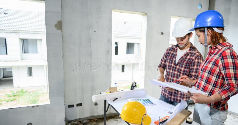 Engineer and Architects Working and Discussing at Construction Site ...
