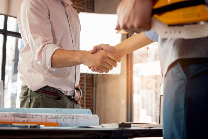 Engineer and Architecture Shaking Hand after Finish an Agreement in the ...