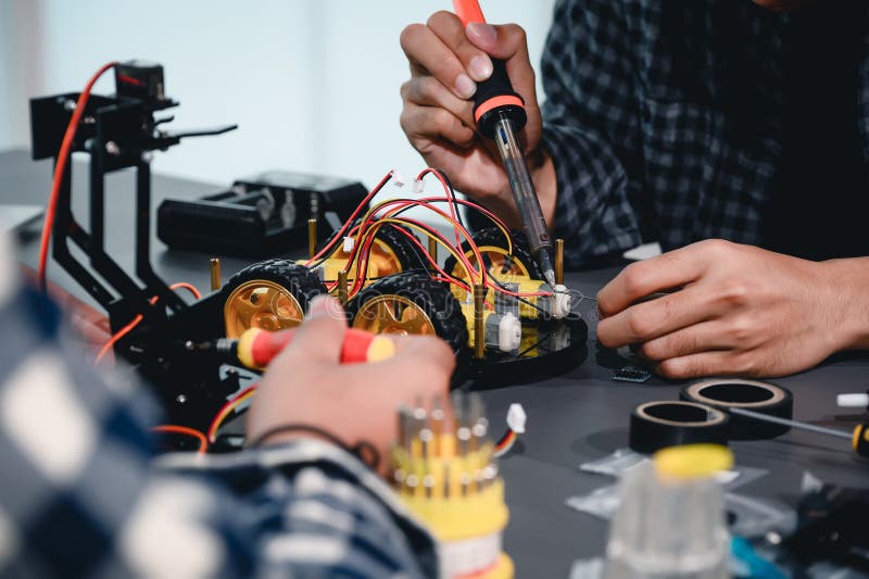 Engineer Asian Students Assembling Robotics Kits. Learning Mechanical ... Engineer Asian Students Assembling Robotics Kits. Learning Mechanical ...