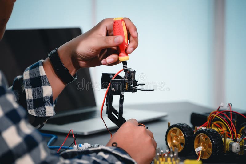 Engineer Asian Students Assembling Robotics Kits. Learning Mechanical ... Engineer Asian Students Assembling Robotics Kits. Learning Mechanical ...