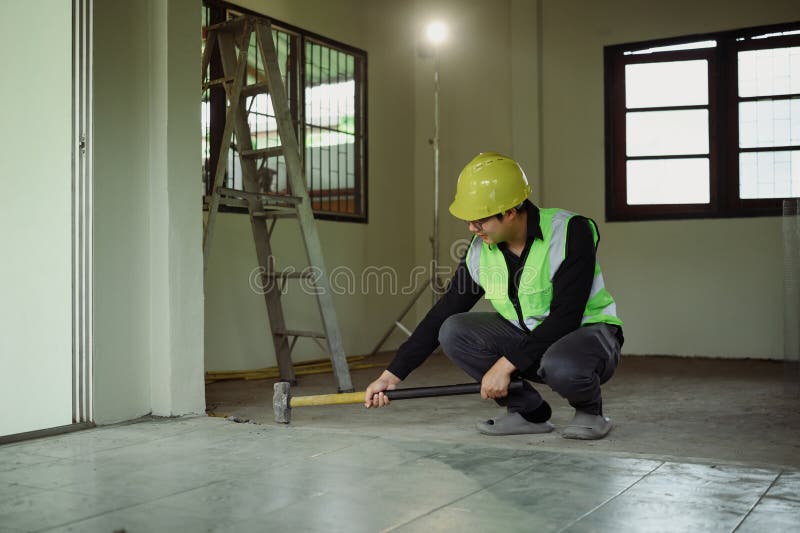Engineer Assessing Floor Removal in a Home Renovation Project Stock ...