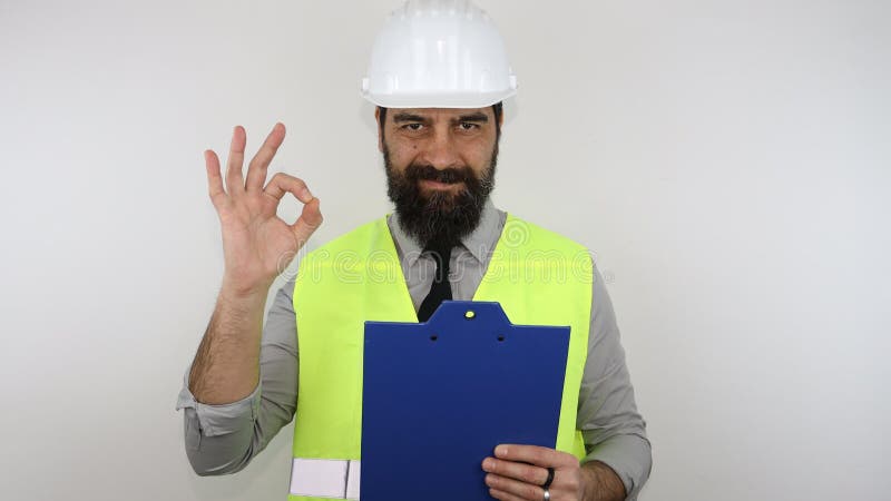 Engineer Wearing Work Helmet, Holding Flip Board and Making Ok Sign ...