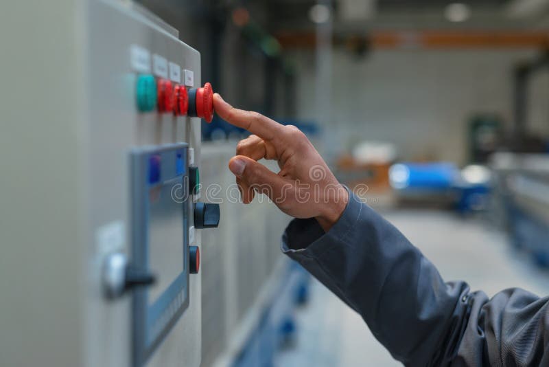 Engineer with Blue Helmet and Safety Goggles, Operating a Control Panel ...