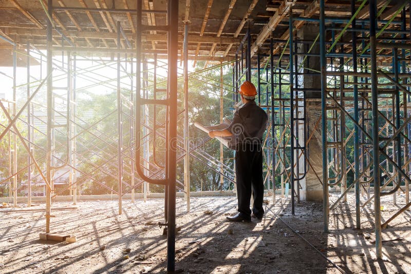 Engineer with Blueprint in Building Construction Site Stock Photo ...