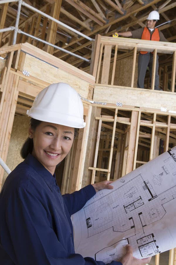 Engineer with Blueprint at Site Stock Photo - Image of person ...