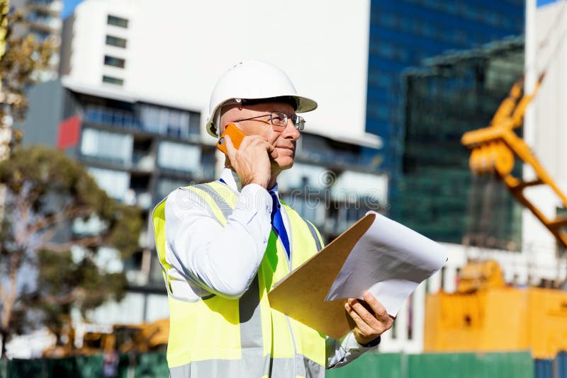 Engineer Builder at Construction Site Stock Photo - Image of drawing ...