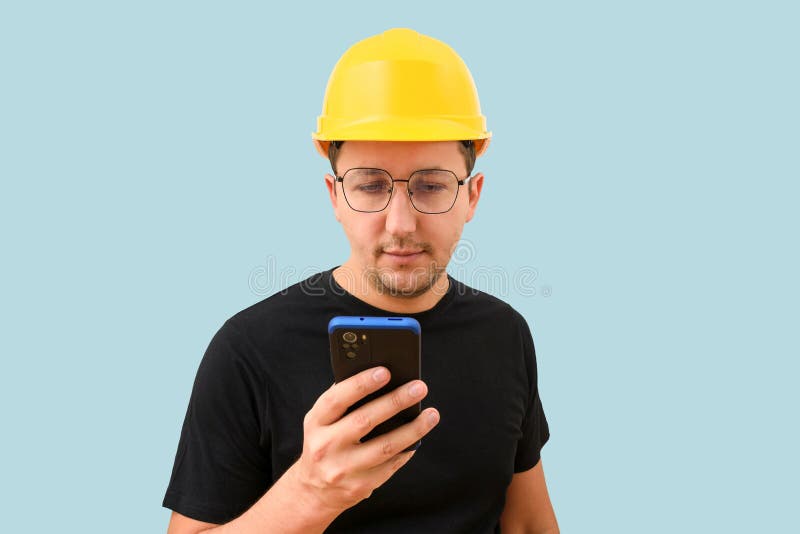 Builder Using Phone. Portrait of Builder Man. Construction Worker with ...