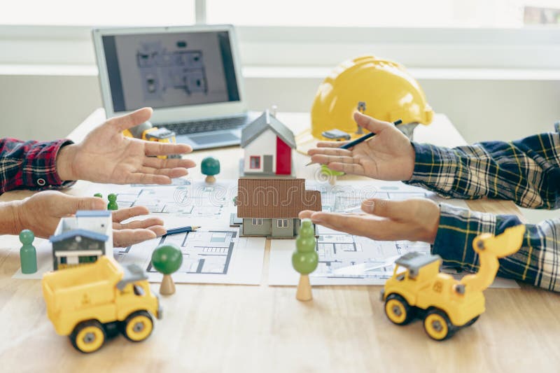 Engineer and Businessman Discussing Construction Project in Office ...