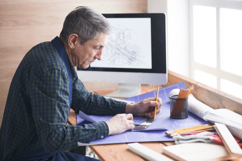 Engineer Carpenter Working on Laptop and Sketching Project Stock Photo ...