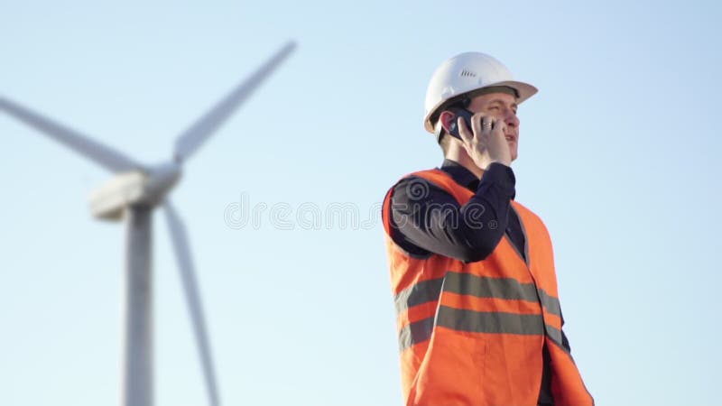 Engineer of Caucasian Appearance with a Serious Look Stand and is ...