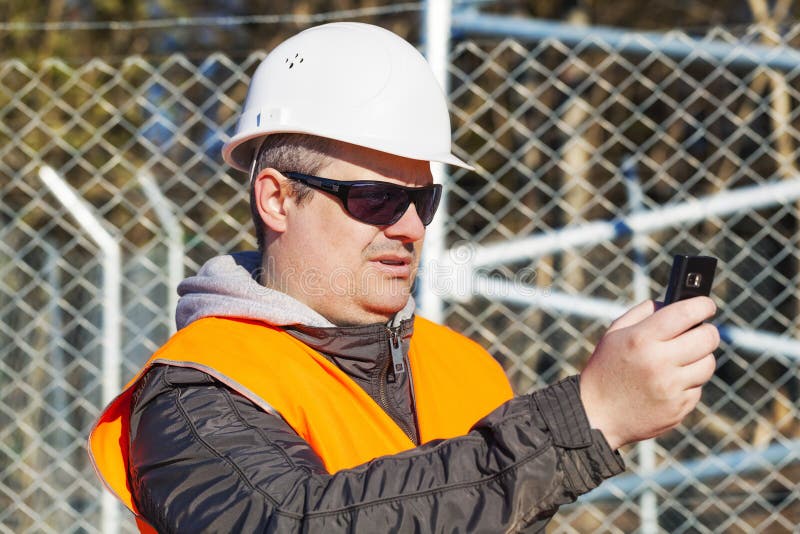 Engineer with the Cell Phone Stock Image - Image of connect ...