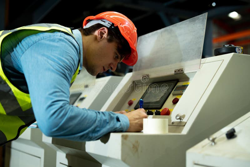 The Engineer is Checking and Inspecting at the Factory. he is Working ...