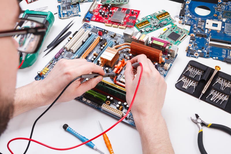 Engineer Checking Motherboard with Multimeter Stock Photo - Image of ...
