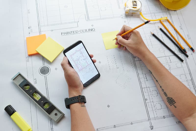 Engineer Checking Plan on Smartphone Stock Photo - Image of plan, hands ...