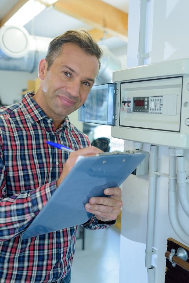 Engineer Checking and Writing on Clipboard Stock Photo - Image of list ...